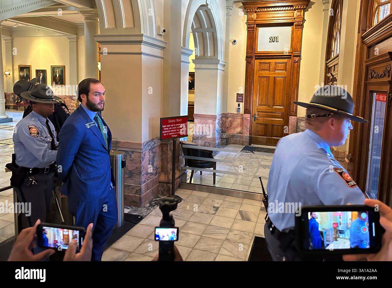 FILE - Georgia state Sen. Colton Moore, R-Trenton, is led out of the ...