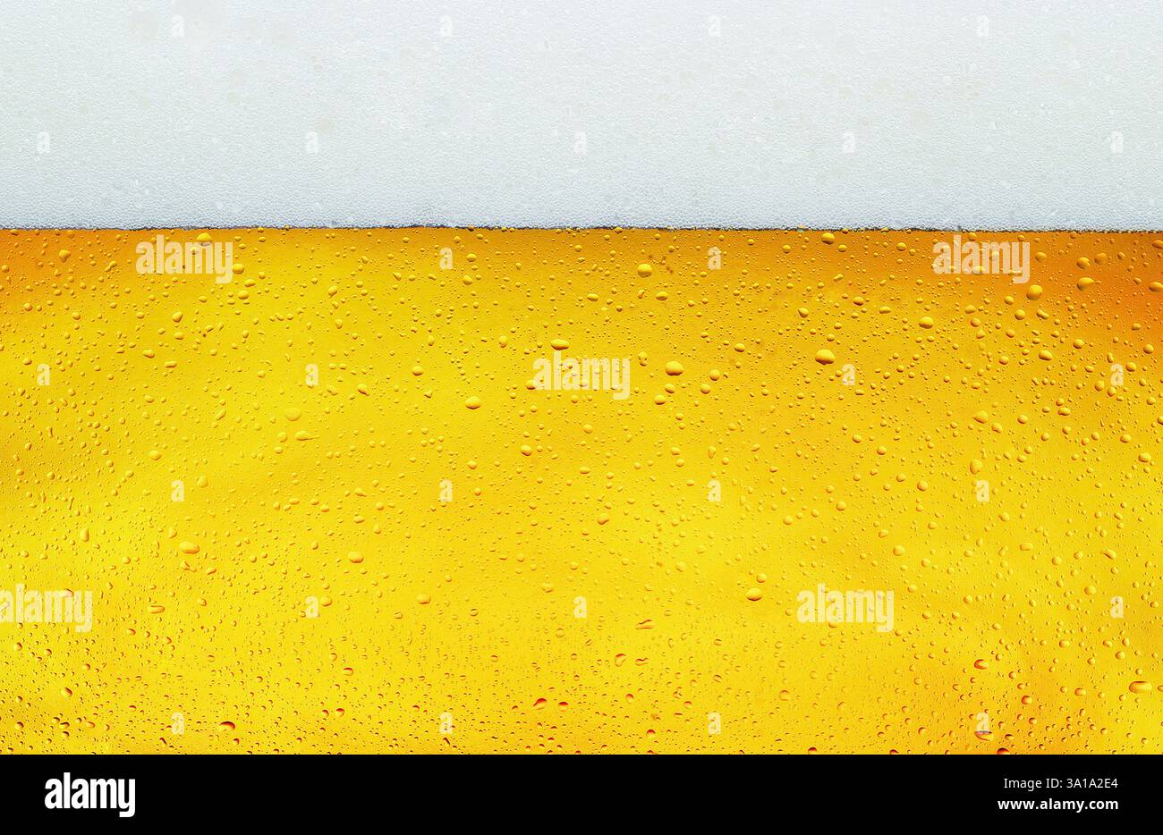 Close up background texture of lager beer with bubbles and froth in ...