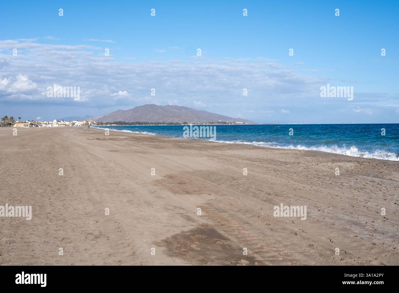 Visitors enjoy a sunny day at Playa de Vera, Almeria, Spain, with a ...