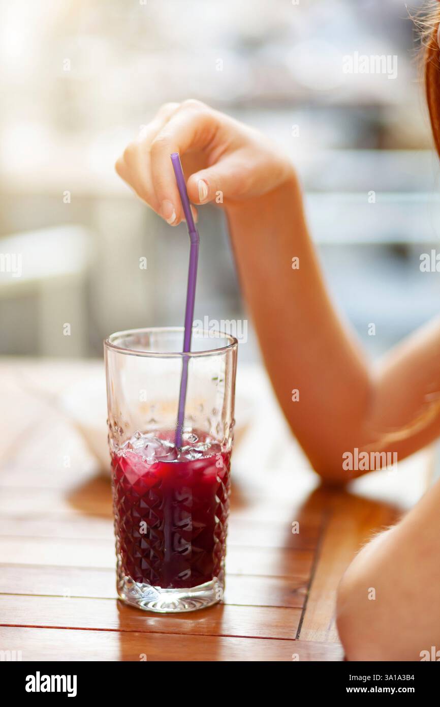 Drinking a cranberry juice. healthy drink concept Stock Photo - Alamy