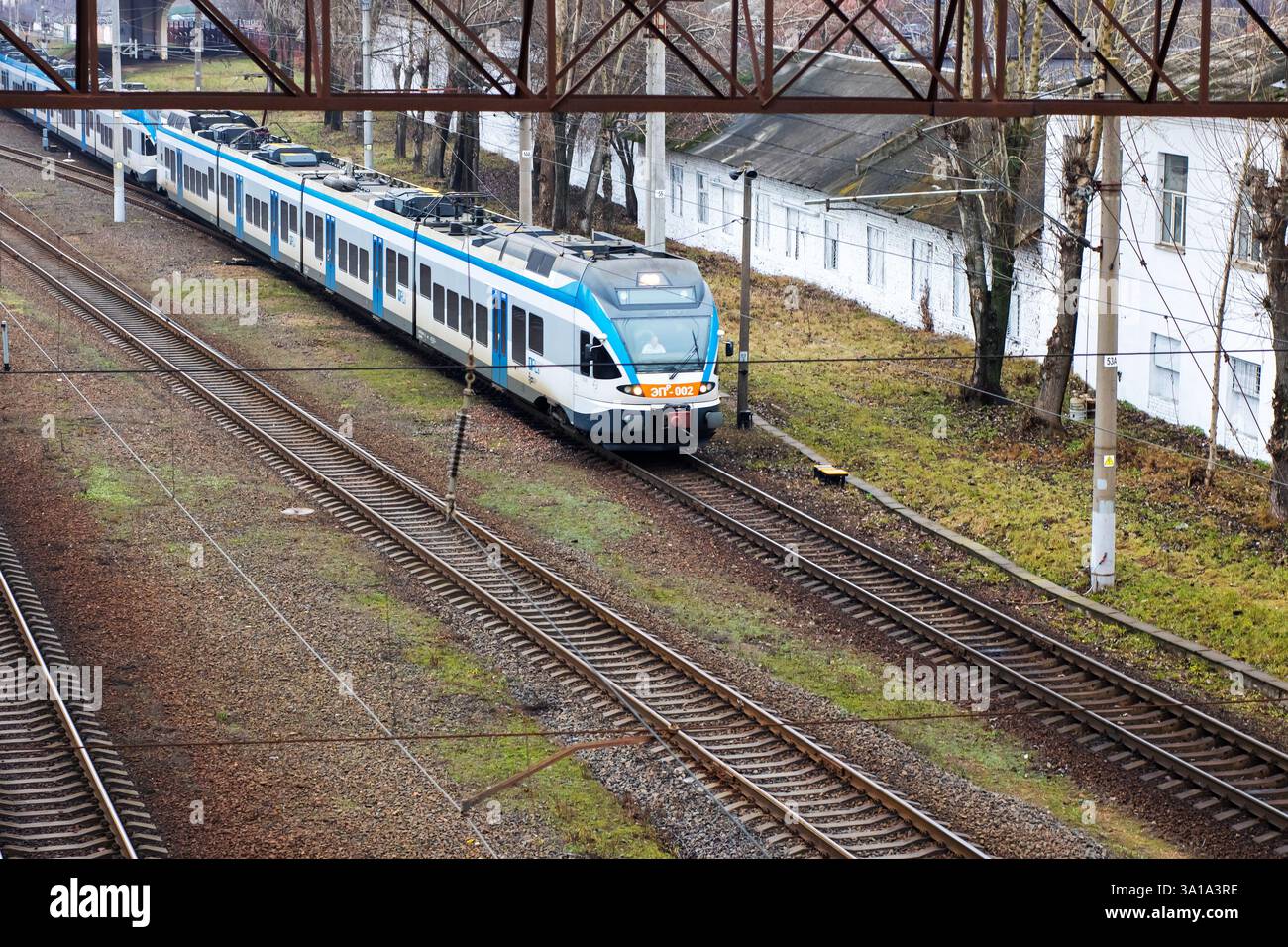 Belarus, Minsk - 02.01.2025: A blue and white train is heading down the ...