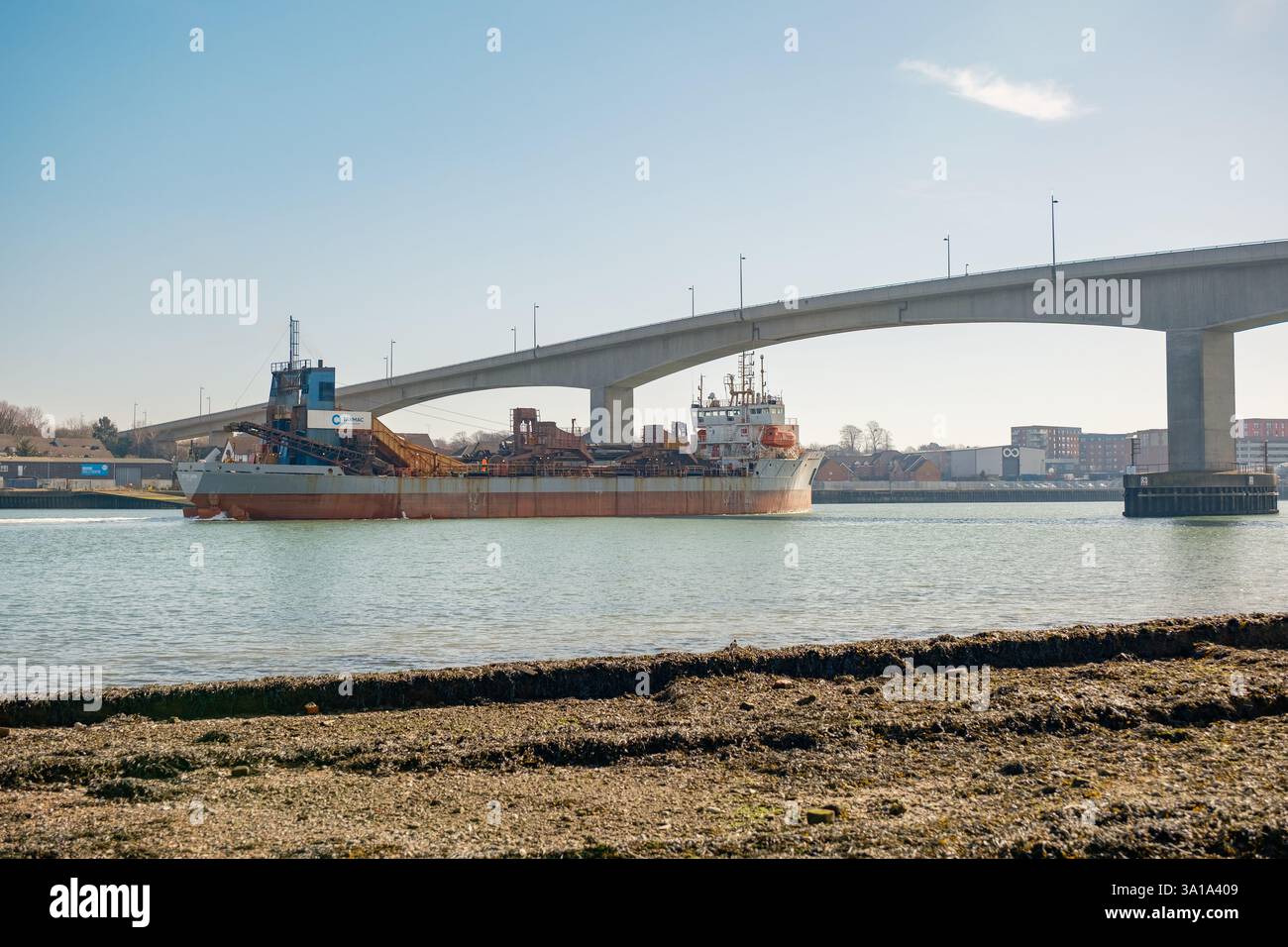 City of London Hooper Dredger ship sails along the River Itchen towards ...