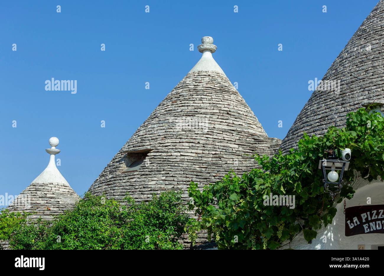 Traditional trulli houses with conical roofs made of stone, a unesco ...