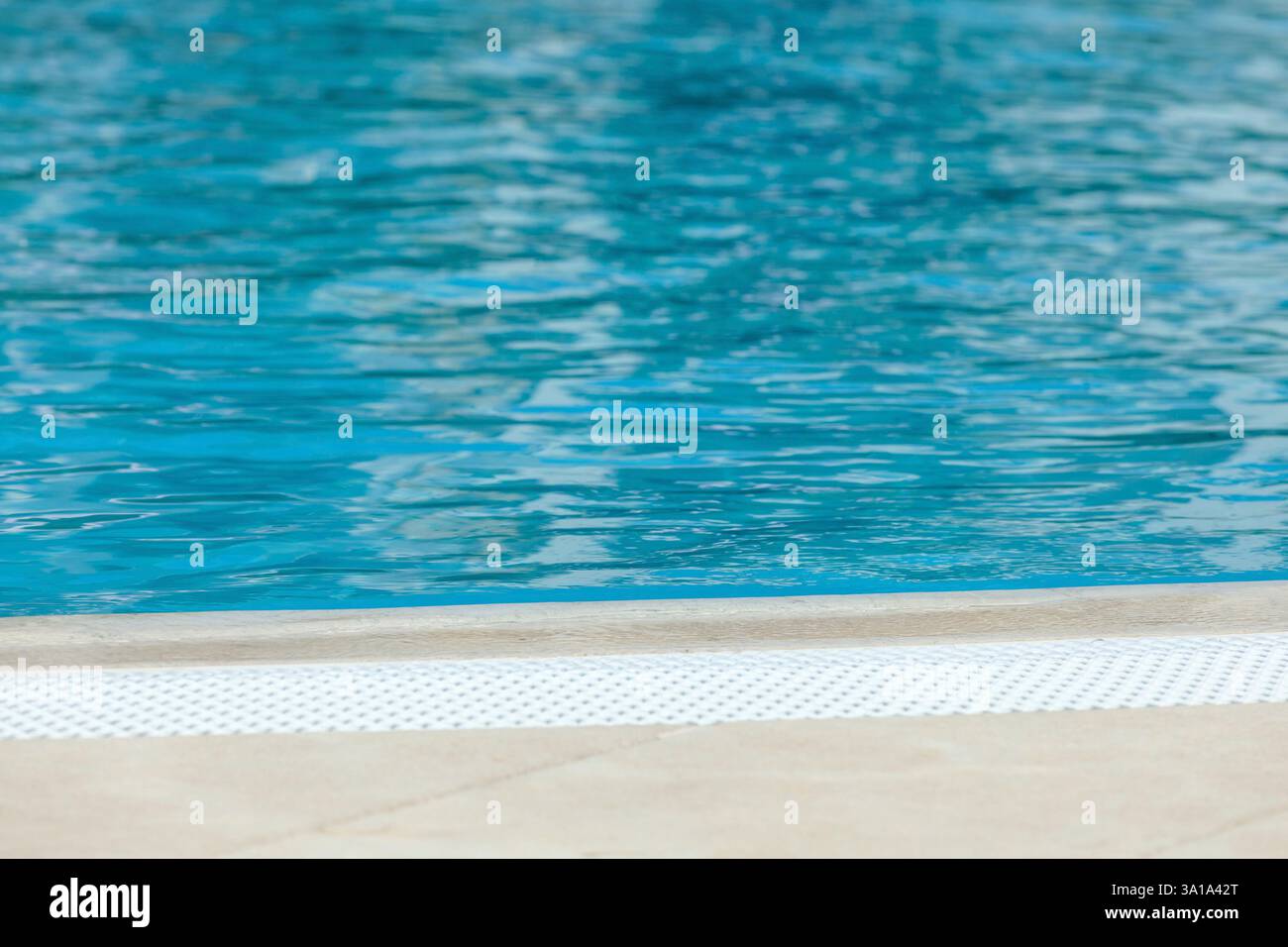 Tranquil blue water surface of swimming pool on sunny day, inviting for ...
