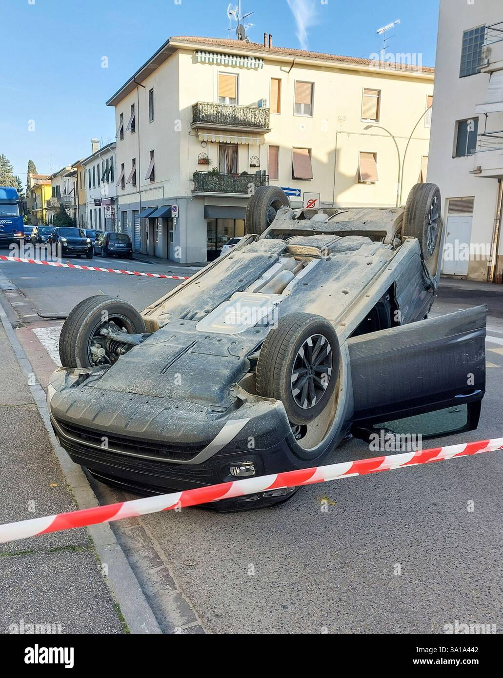 Car is lying upside down on the road after a dangerous car crash in the ...