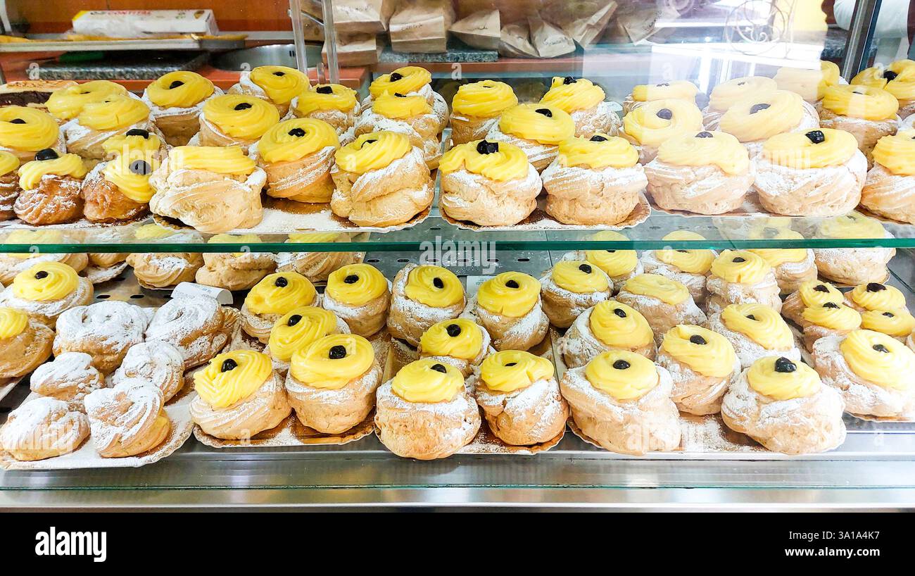 Two overflowing shelves of delectable zeppole di San giuseppe, a ...