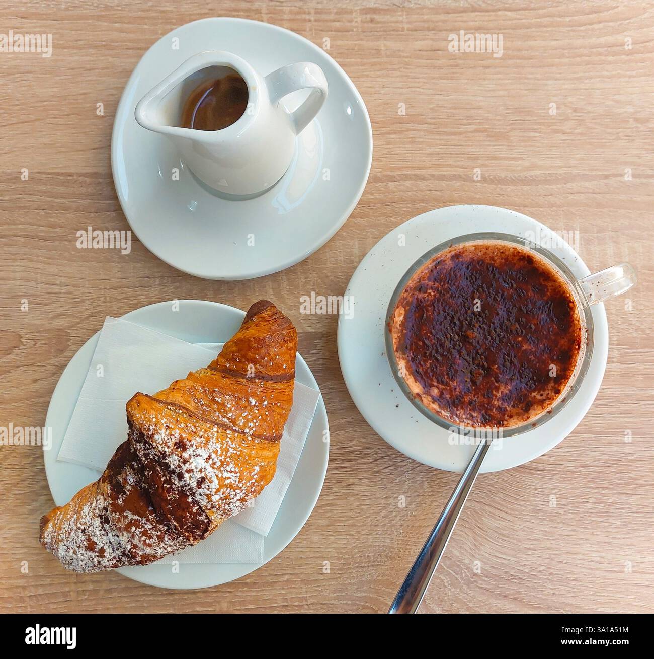 Top view of a breakfast with chocolate croissant, milk with cocoa ...