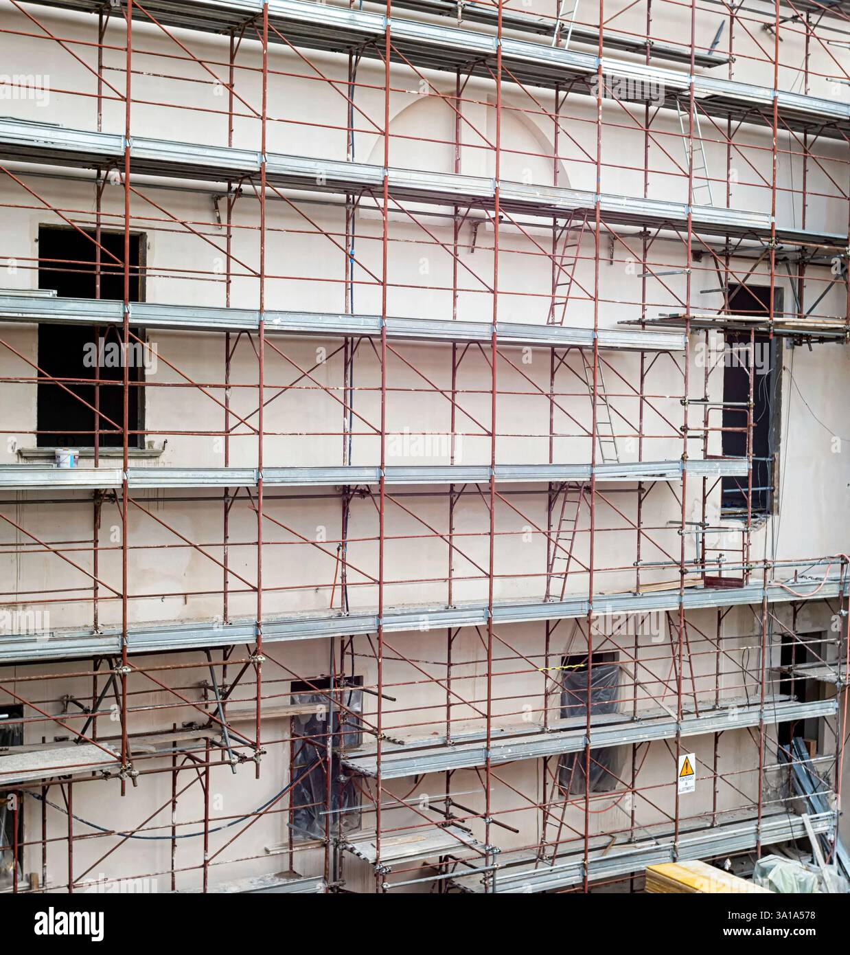 Scaffolding installed on a building under renovation hi-res stock photography and images - Alamy
