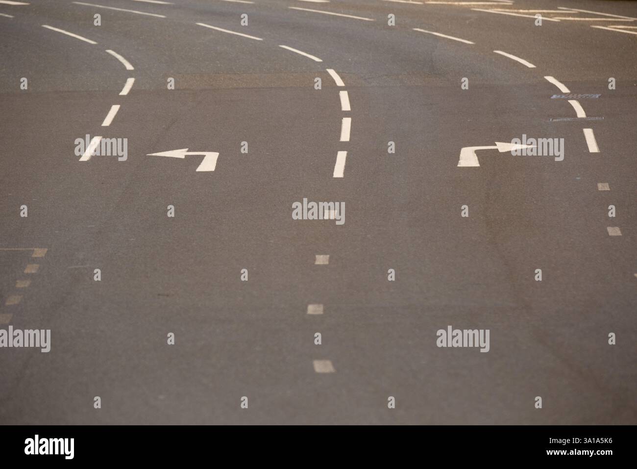 Road markings showing left turns at a city street intersection Stock ...