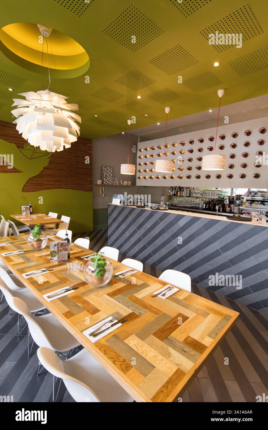 Restaurant interior A dining area with a mosaic wood table and a slate ...