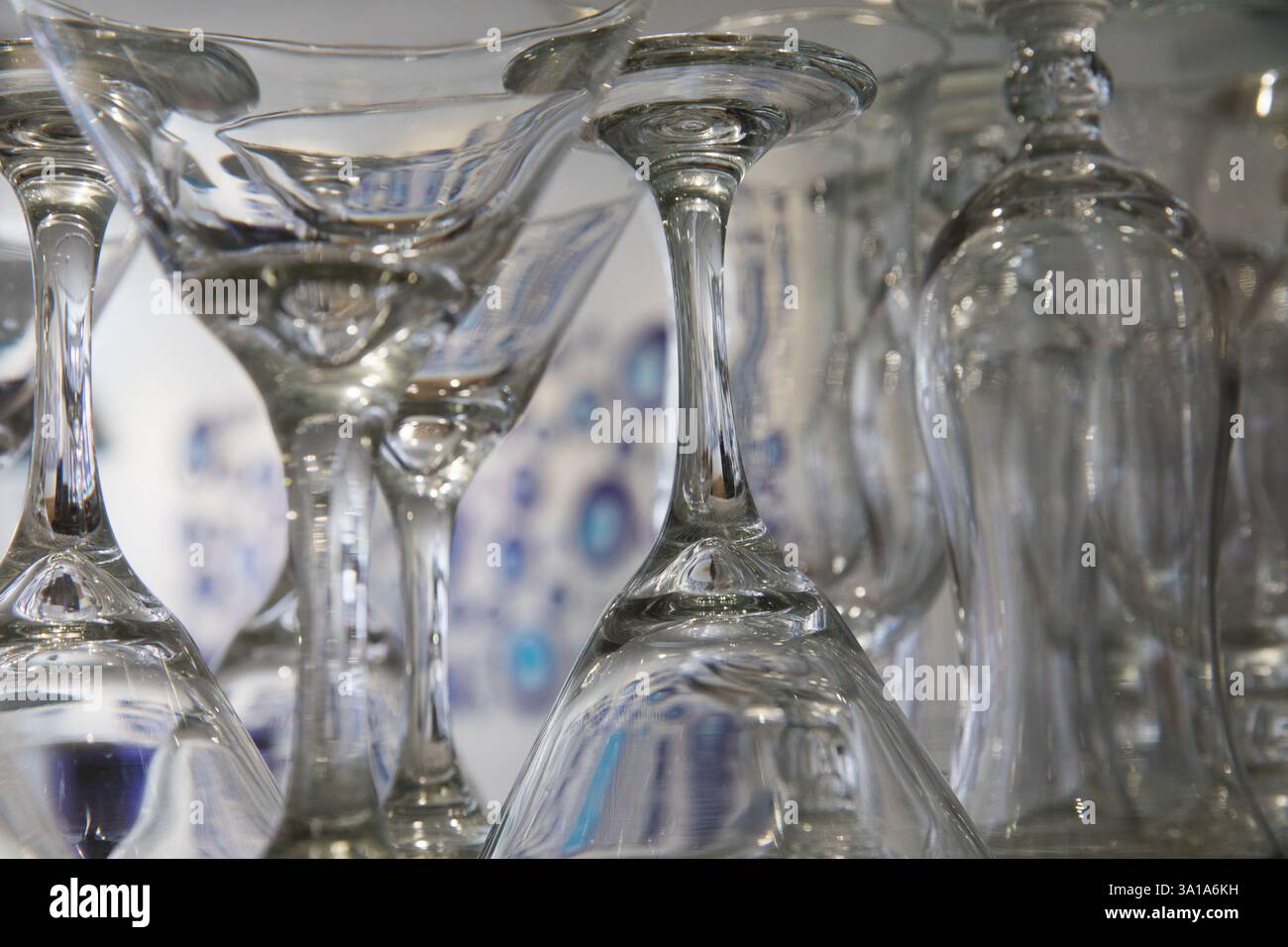 Stacked empty martini glasses at a bar Stock Photo - Alamy