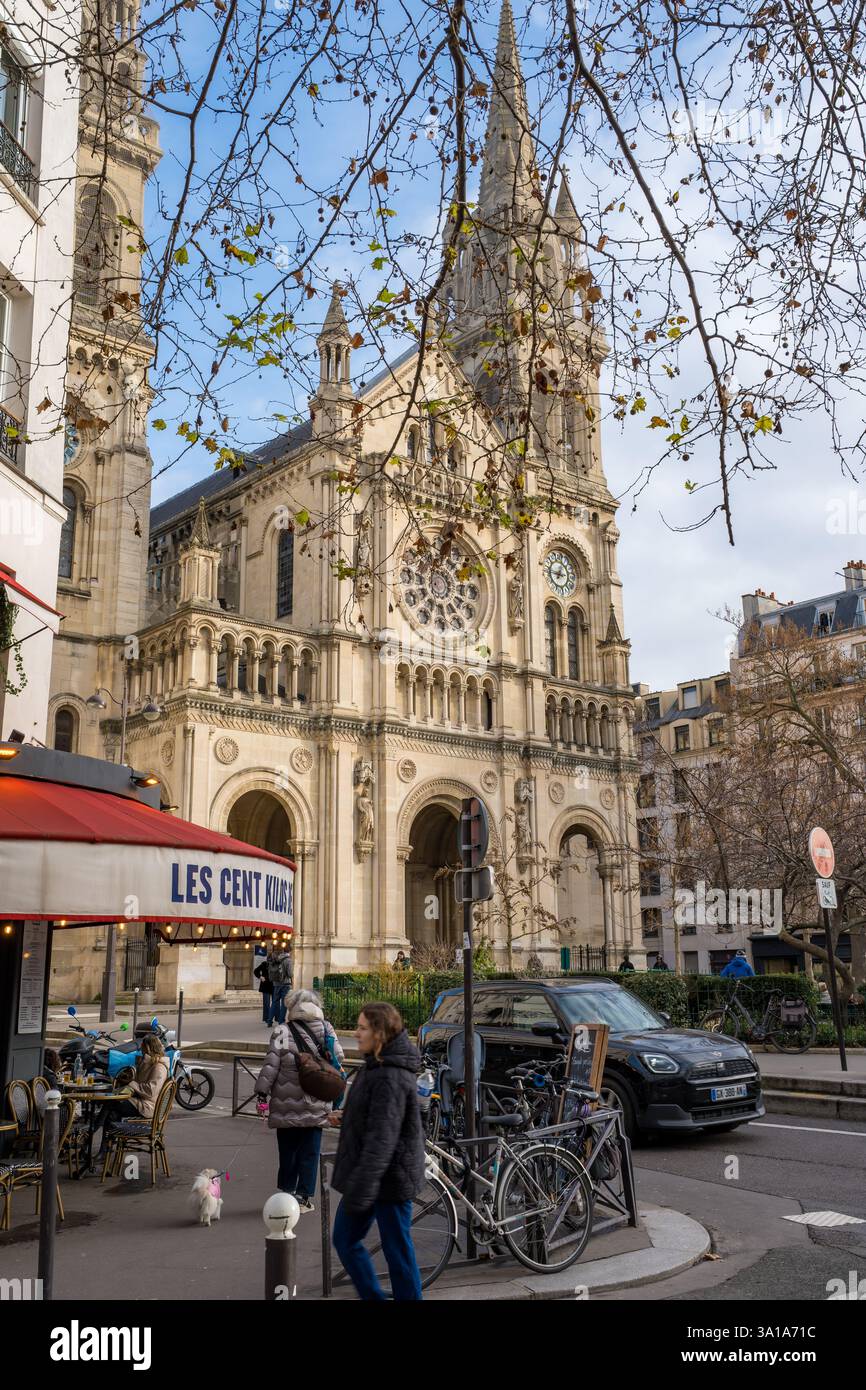 Charming Parisian street scene with a historical church backdrop and ...