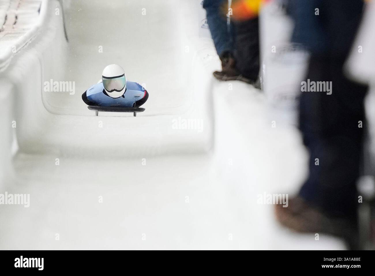 Qinwei Lin, of China, finishes his fourth run at the skeleton world championships, Friday, March ...