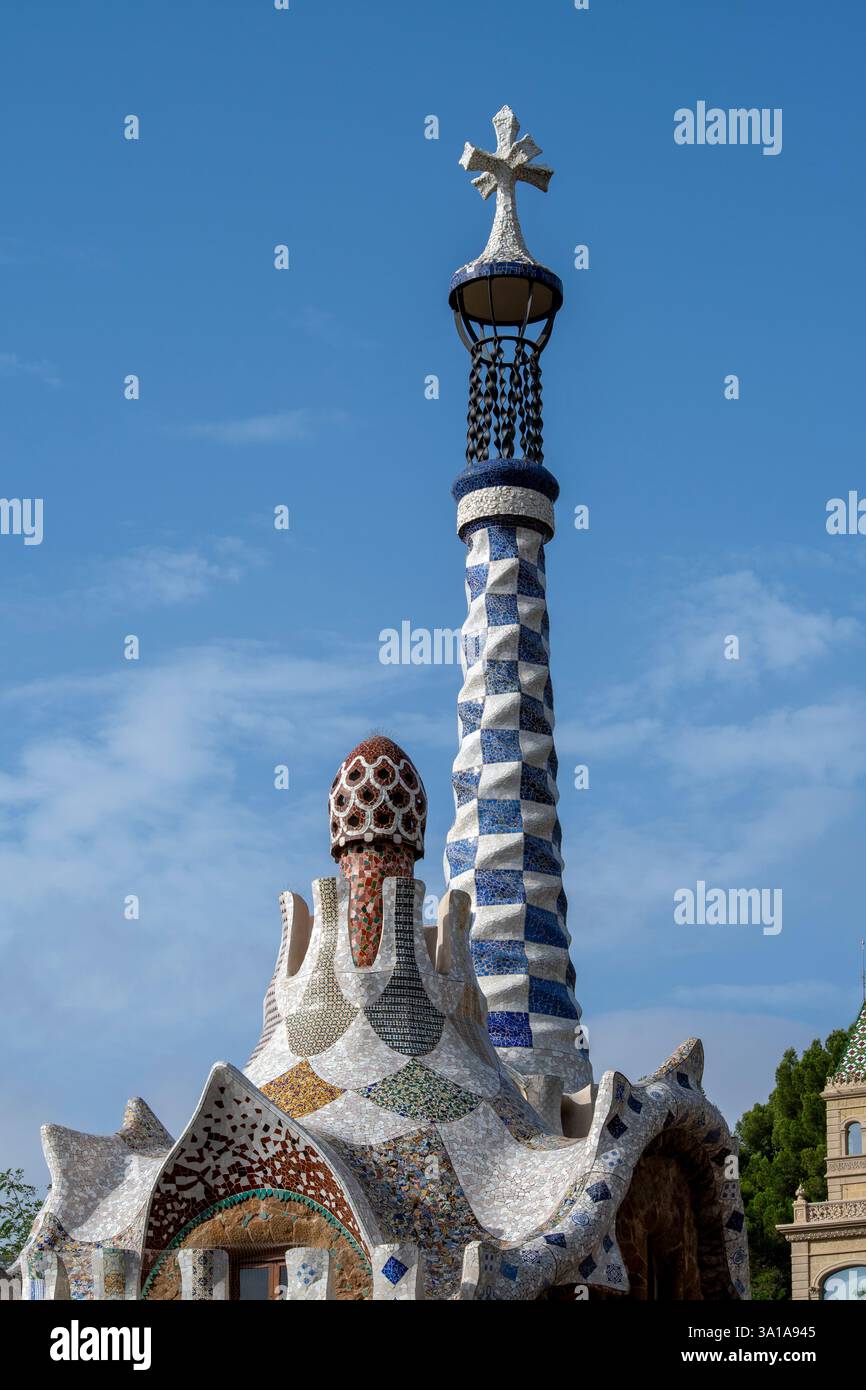 Ornate tiled towers of one of the entrance pavilions at Park Guell by ...