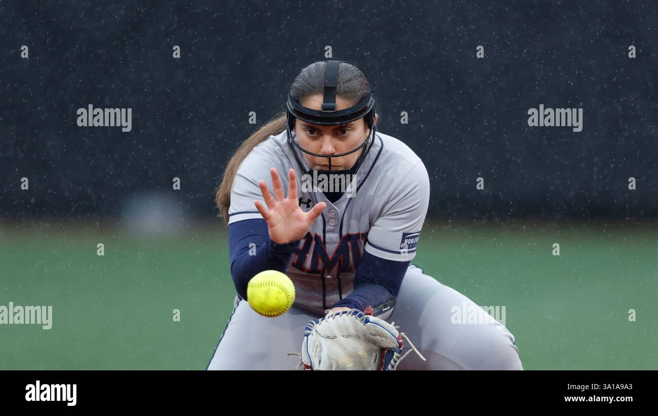 Robert Morris infielder Anna Resnik catches the ball before an NCAA ...