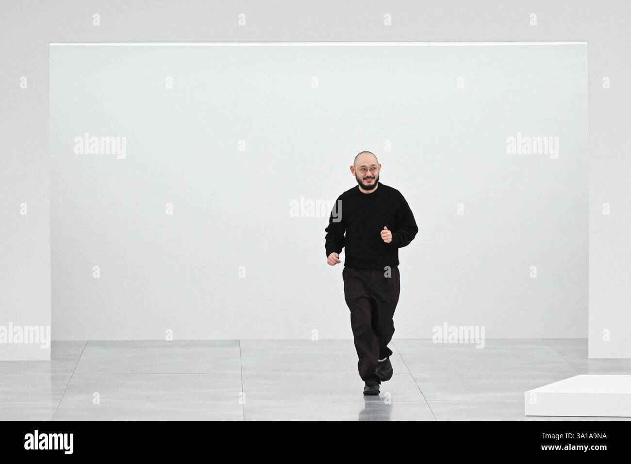 Designer Satoshi Kondo makes an appearance on the runway during the ...