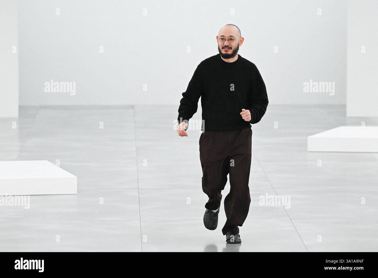 Designer Satoshi Kondo makes an appearance on the runway during the ...