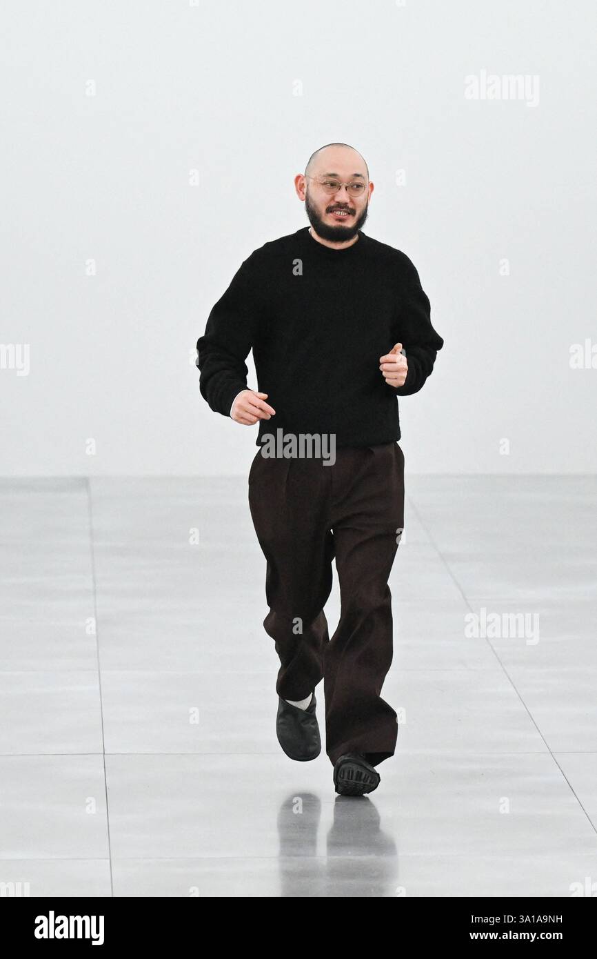 Designer Satoshi Kondo makes an appearance on the runway during the Issey Miyake Womenswear Fall ...
