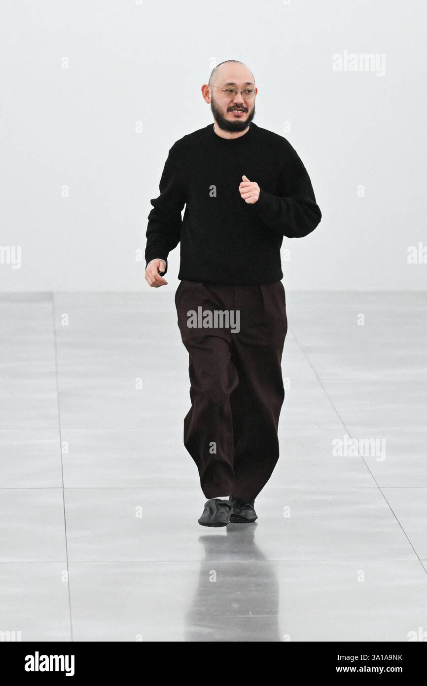 Designer Satoshi Kondo makes an appearance on the runway during the ...