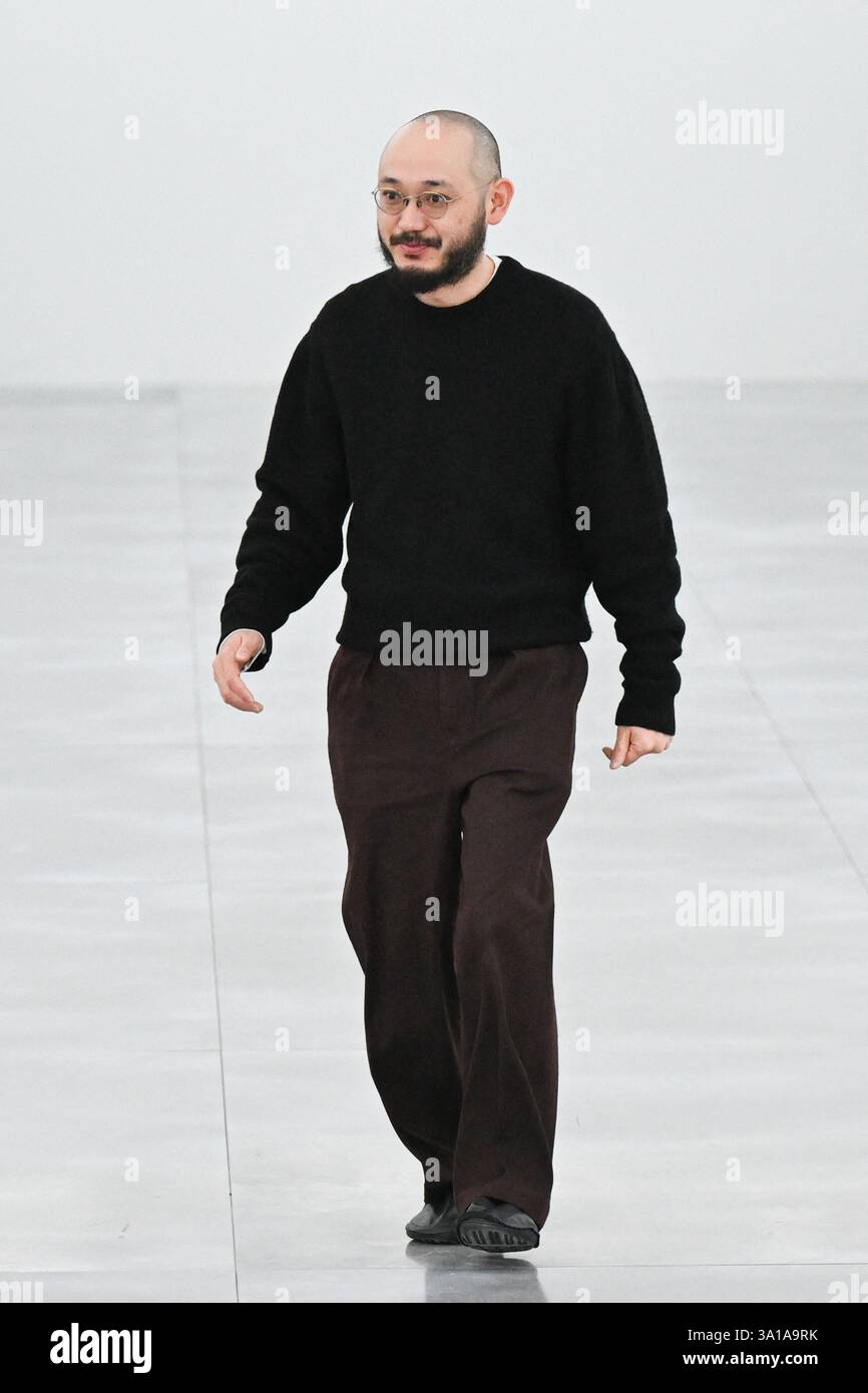 Designer Satoshi Kondo makes an appearance on the runway during the ...