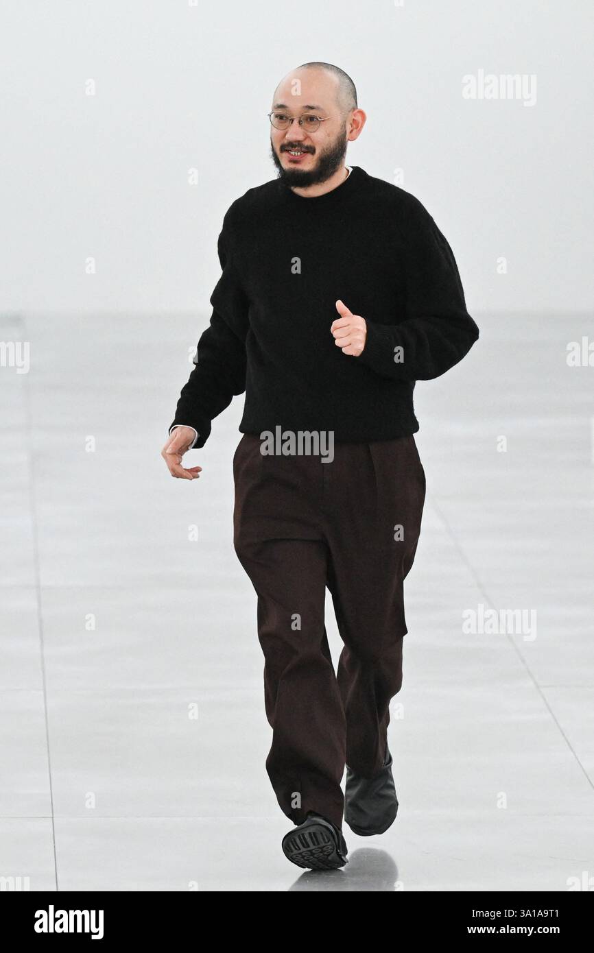 Designer Satoshi Kondo makes an appearance on the runway during the Issey Miyake Womenswear Fall ...