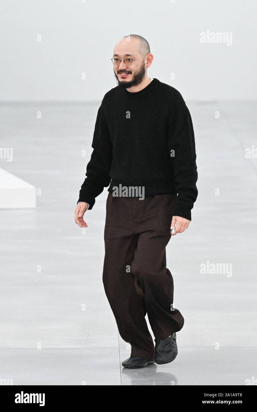 Designer Satoshi Kondo makes an appearance on the runway during the Issey Miyake Womenswear Fall ...