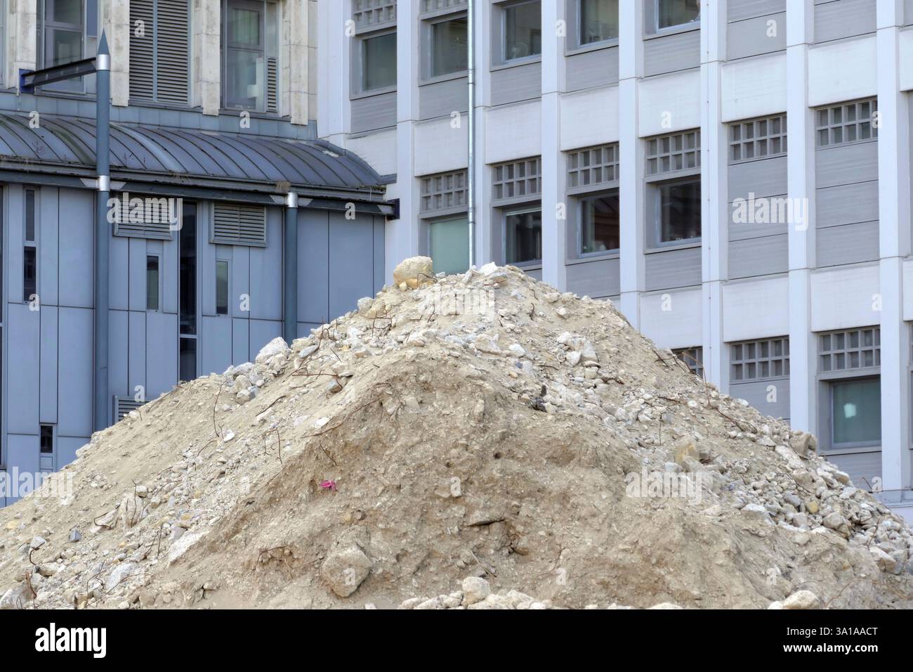 Rubble pile in front of a tower block Stock Photo - Alamy