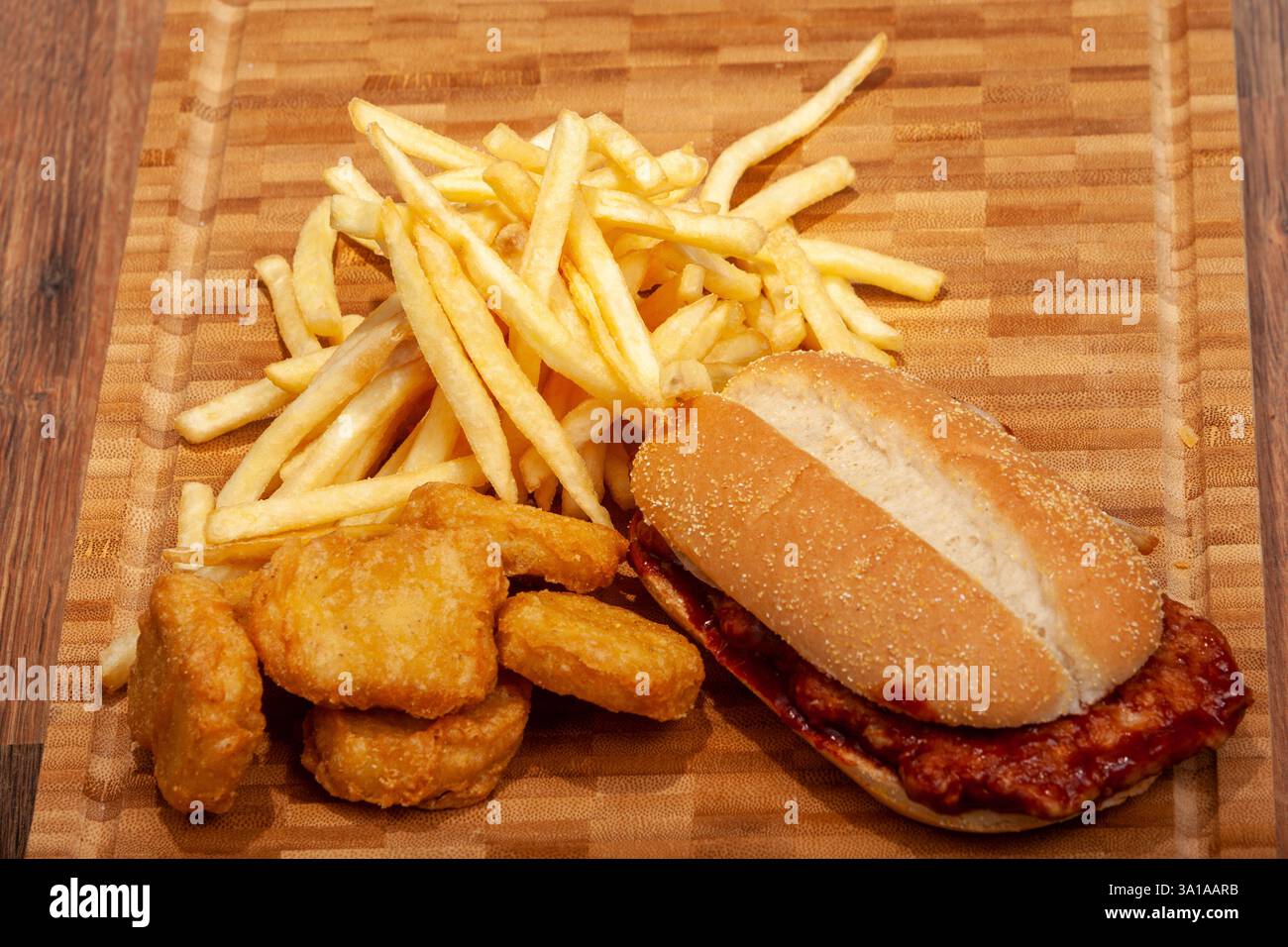Classic fast food, with nuggets, burgers, fries Stock Photo - Alamy