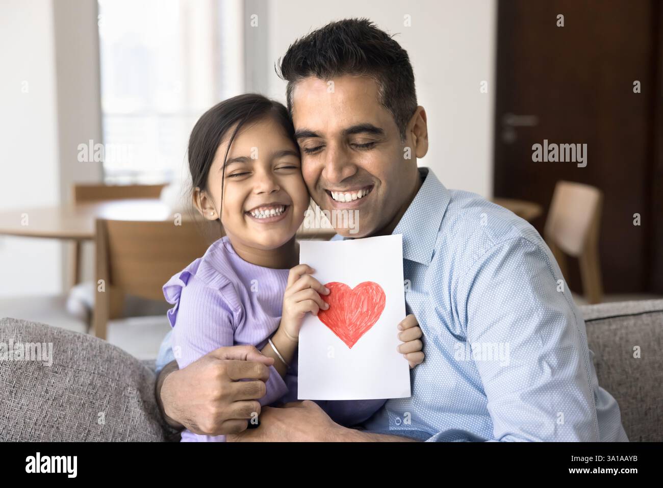 Lovely Indian daughter congratulate his daddy with life event Stock ...