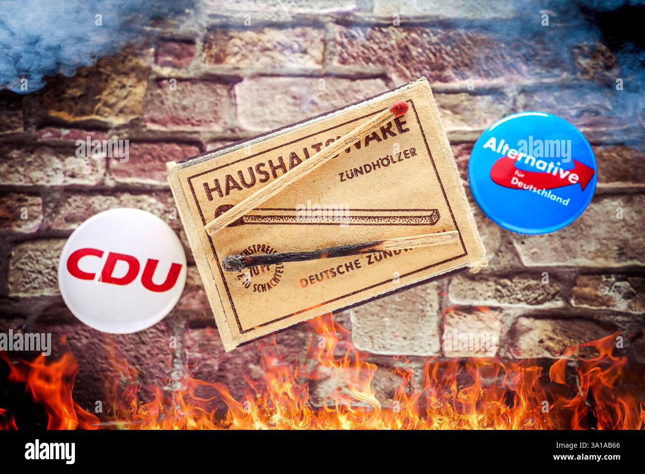 PHOTOMONTAGE, CDU and AfD party badges in front of wall with matchbox ...