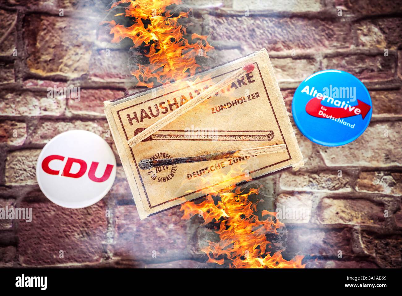 PHOTOMONTAGE, CDU and AfD party badges in front of wall with matchbox ...