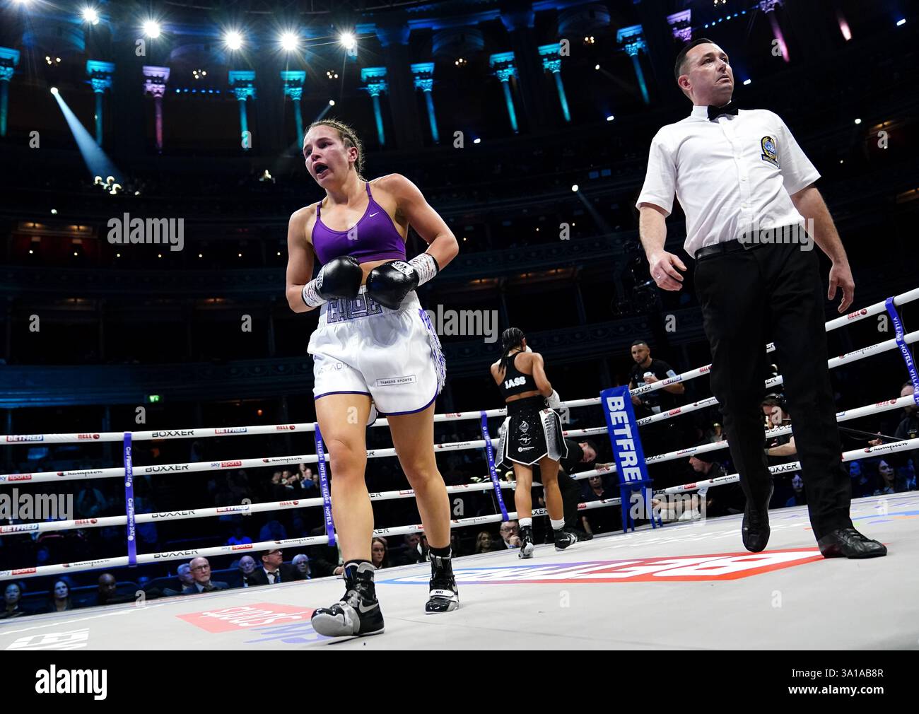 Chloe Watson (left) walks to her corner in the EBU European Fly weight ...