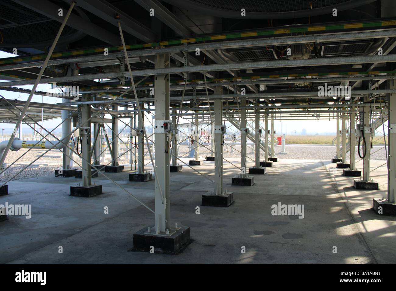 An industrial structure with a network of metal beams, support columns ...