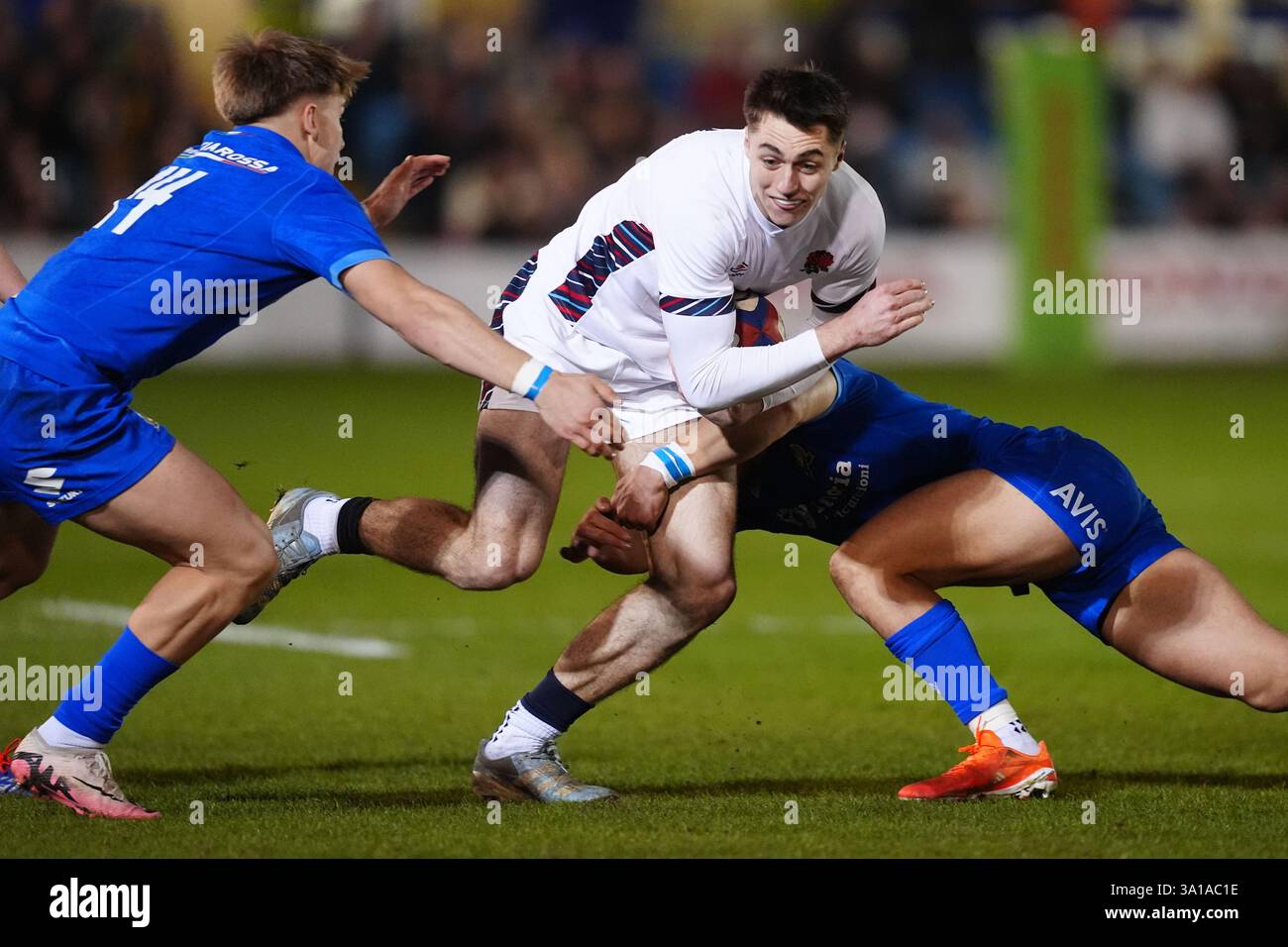 England's Campbell Ridl (centre) is tackled by Italy's Alessandro Drago ...
