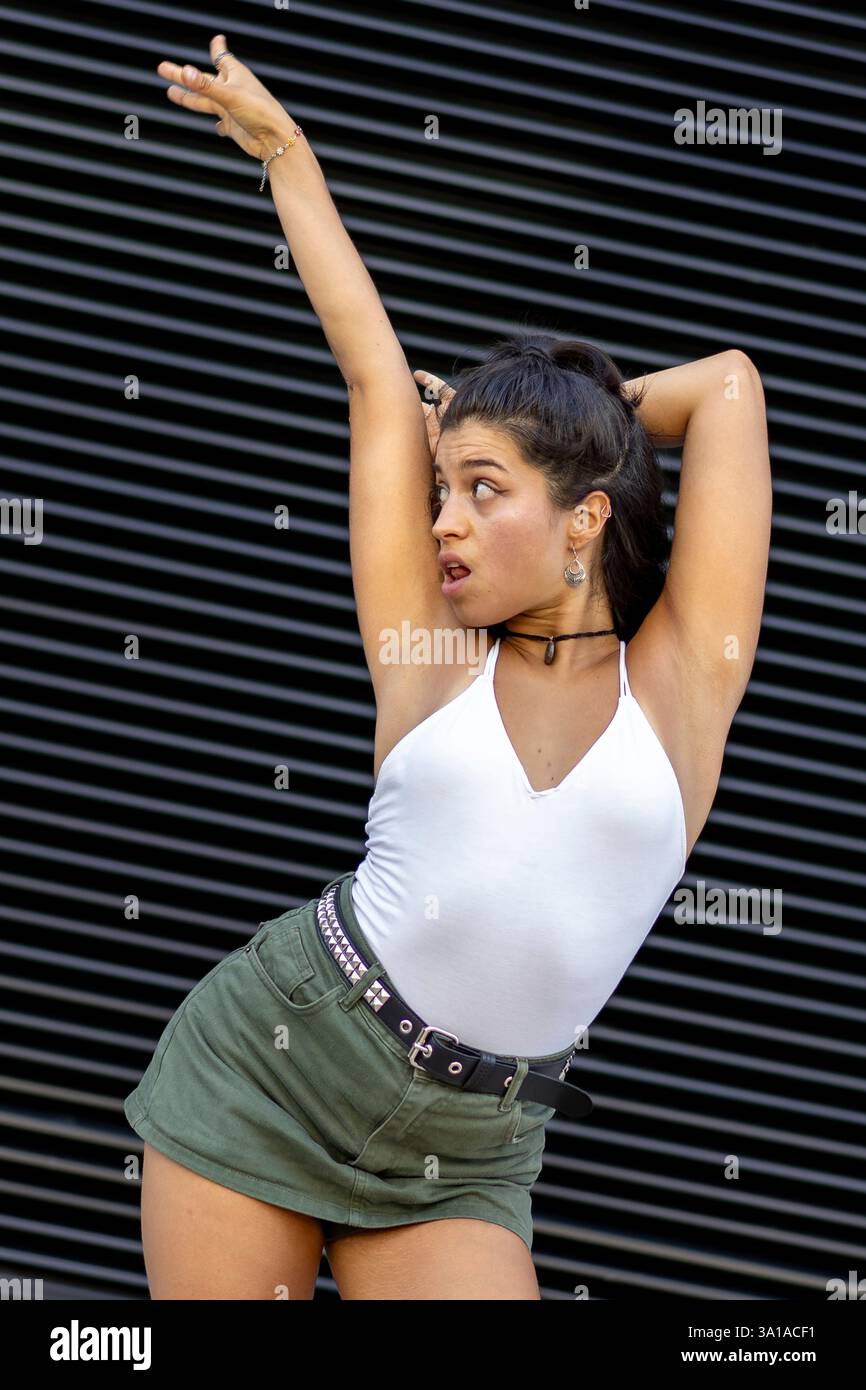 Latin confident dancer radiating positivity and style Stock Photo - Alamy