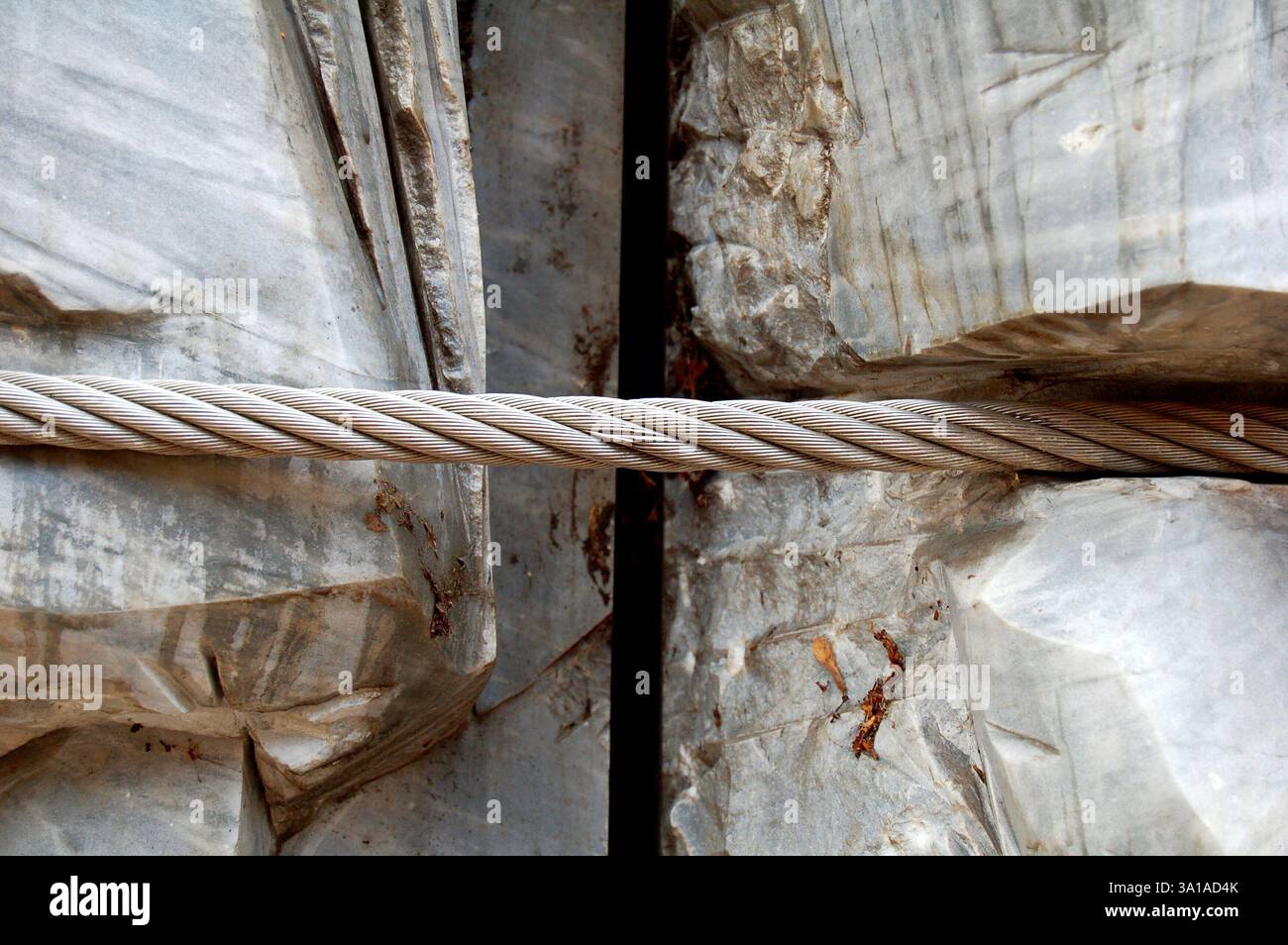 Steel cables encircle two marble blocks hi-res stock photography and ...