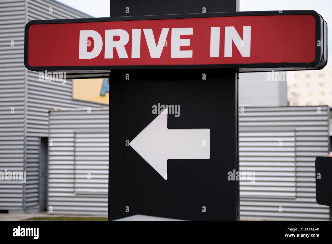 Drive-in sign for a fast food restaurant in a commercial area. The ...
