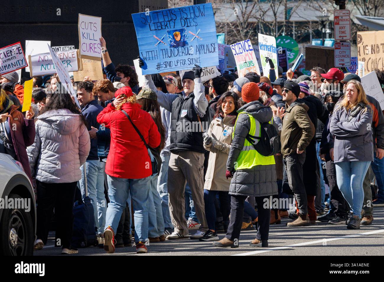Demonstrators hold signs during a Stand of for Science Philadelphia ...