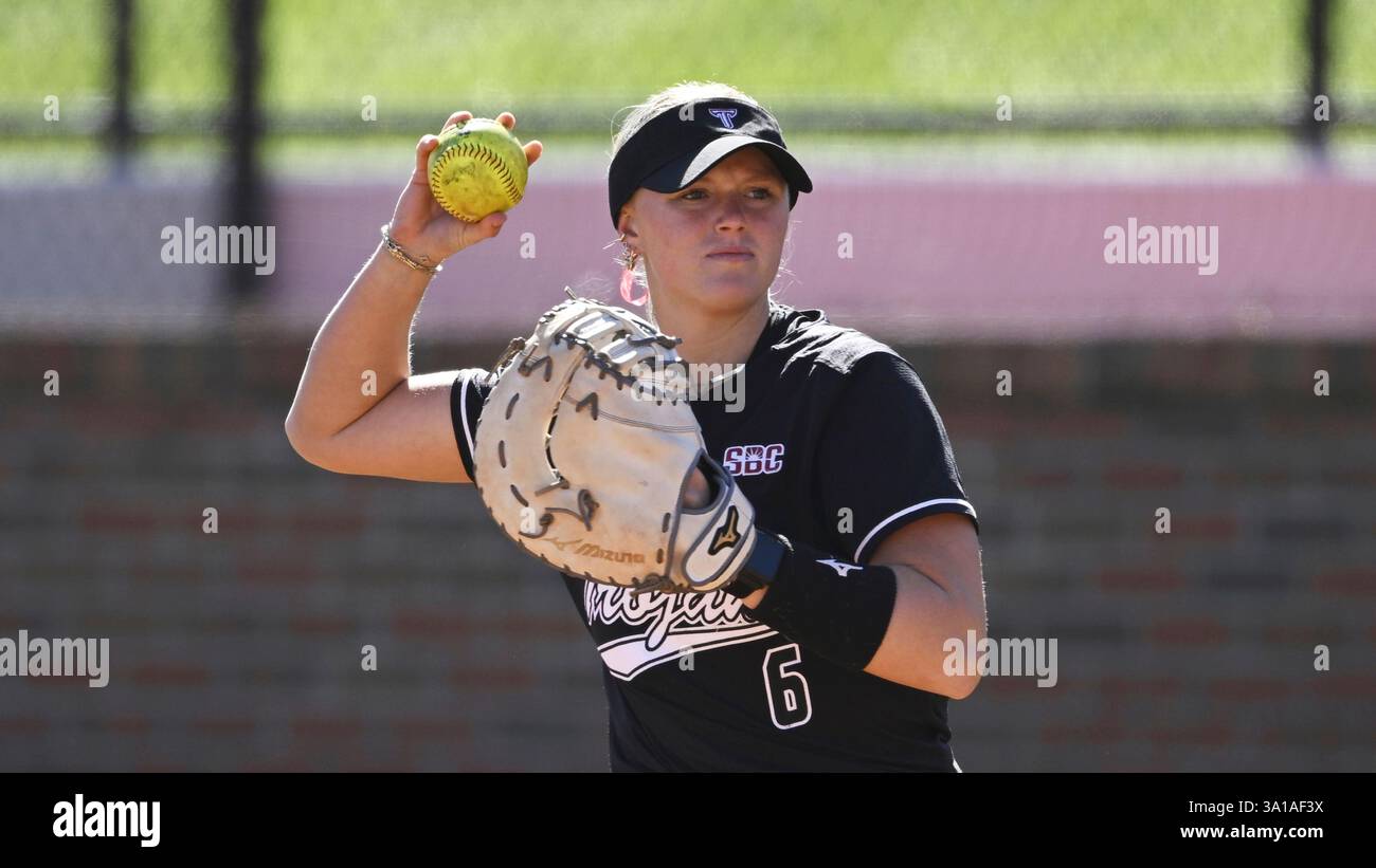 Troy infielder Caiden Oliva (6) throws during an NCAA college softball ...