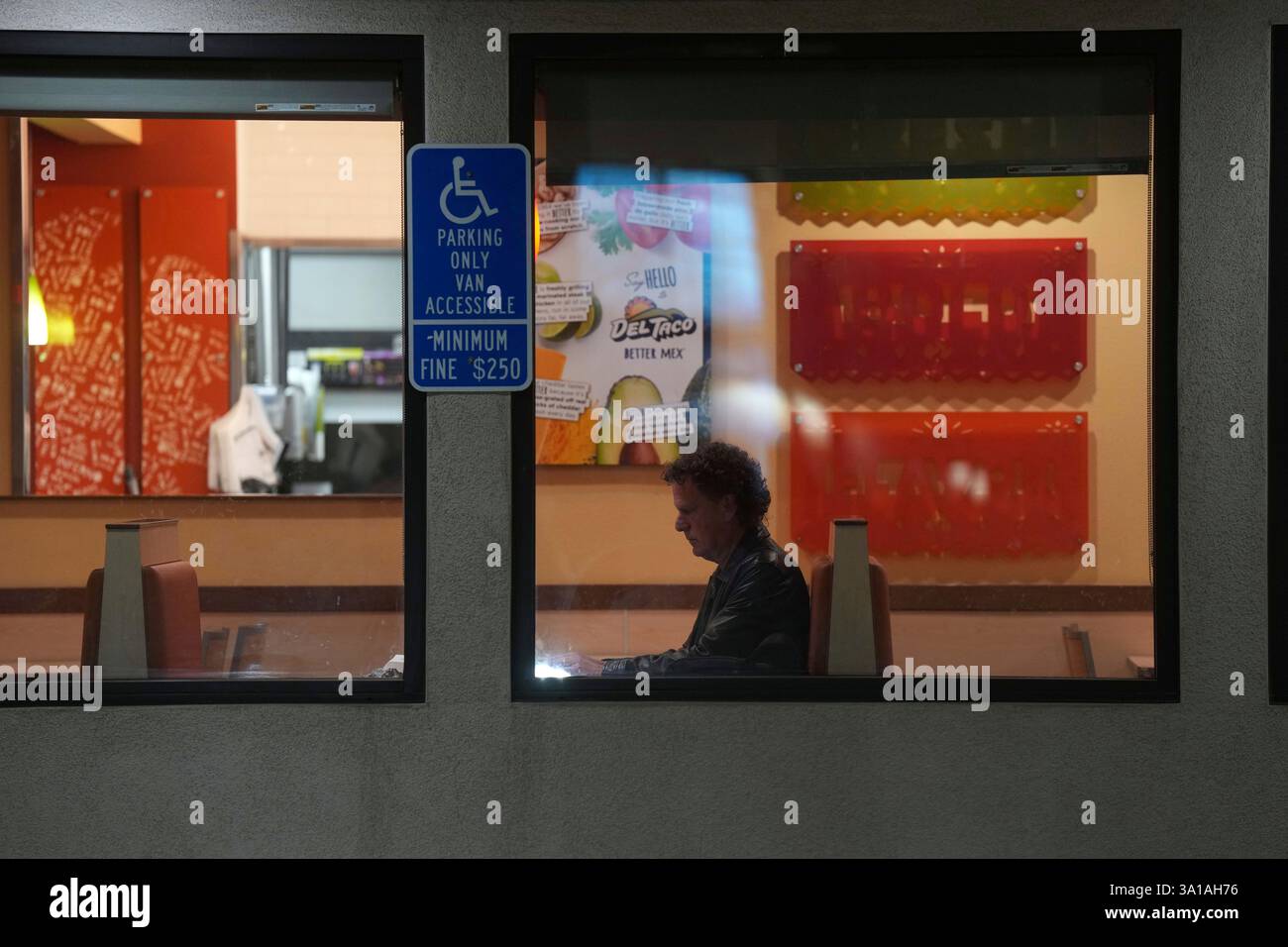 Orange County Register newspaper reporter Steve Fryer writes a story ...