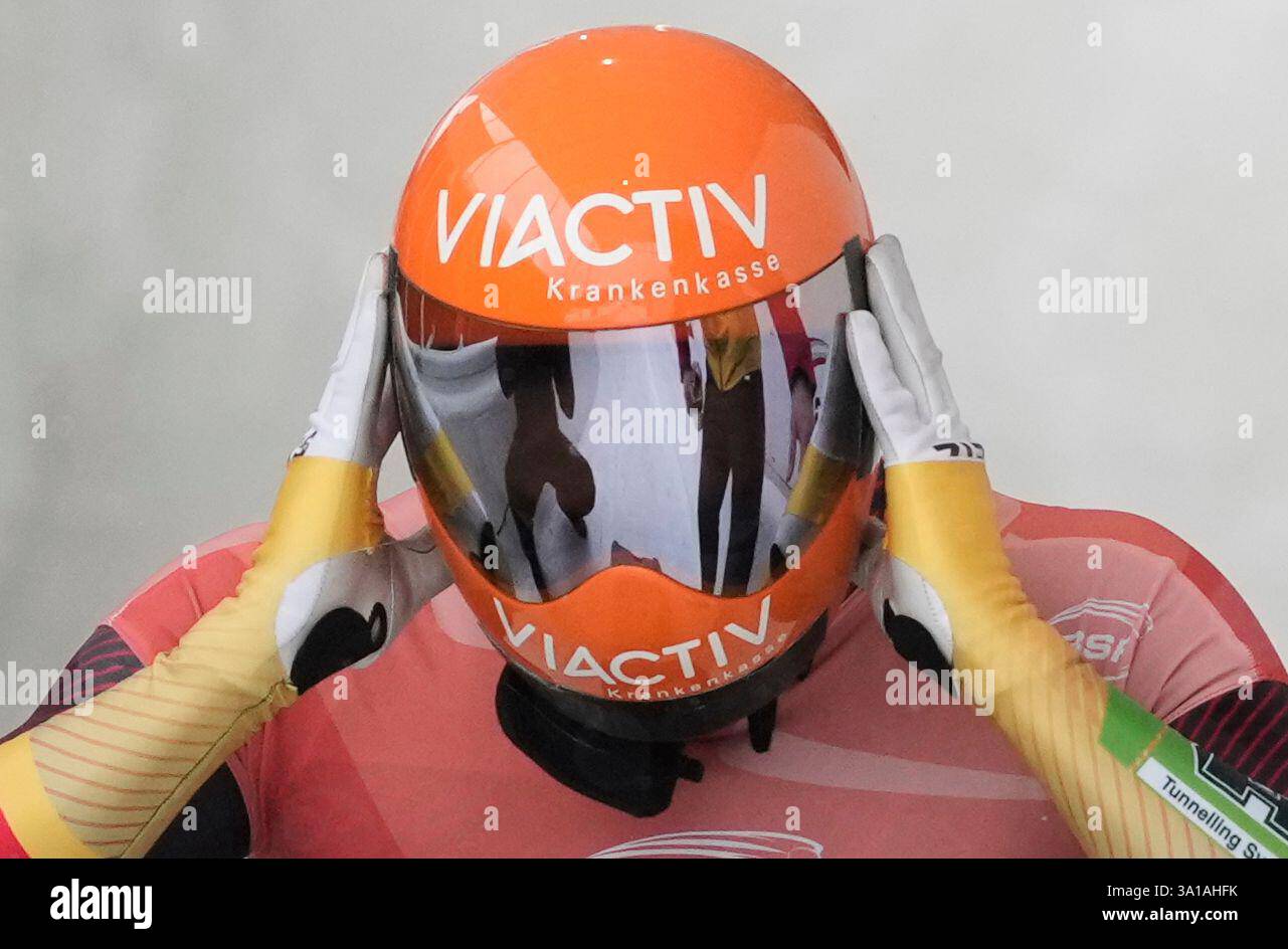 Christopher Grotheer, of Germany, takes off his helmet after he ...