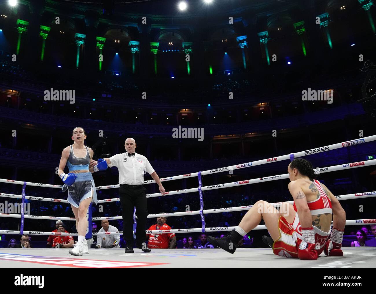 Karriss Artingstall (left) knocks down Raven Chapman in the vacant ...