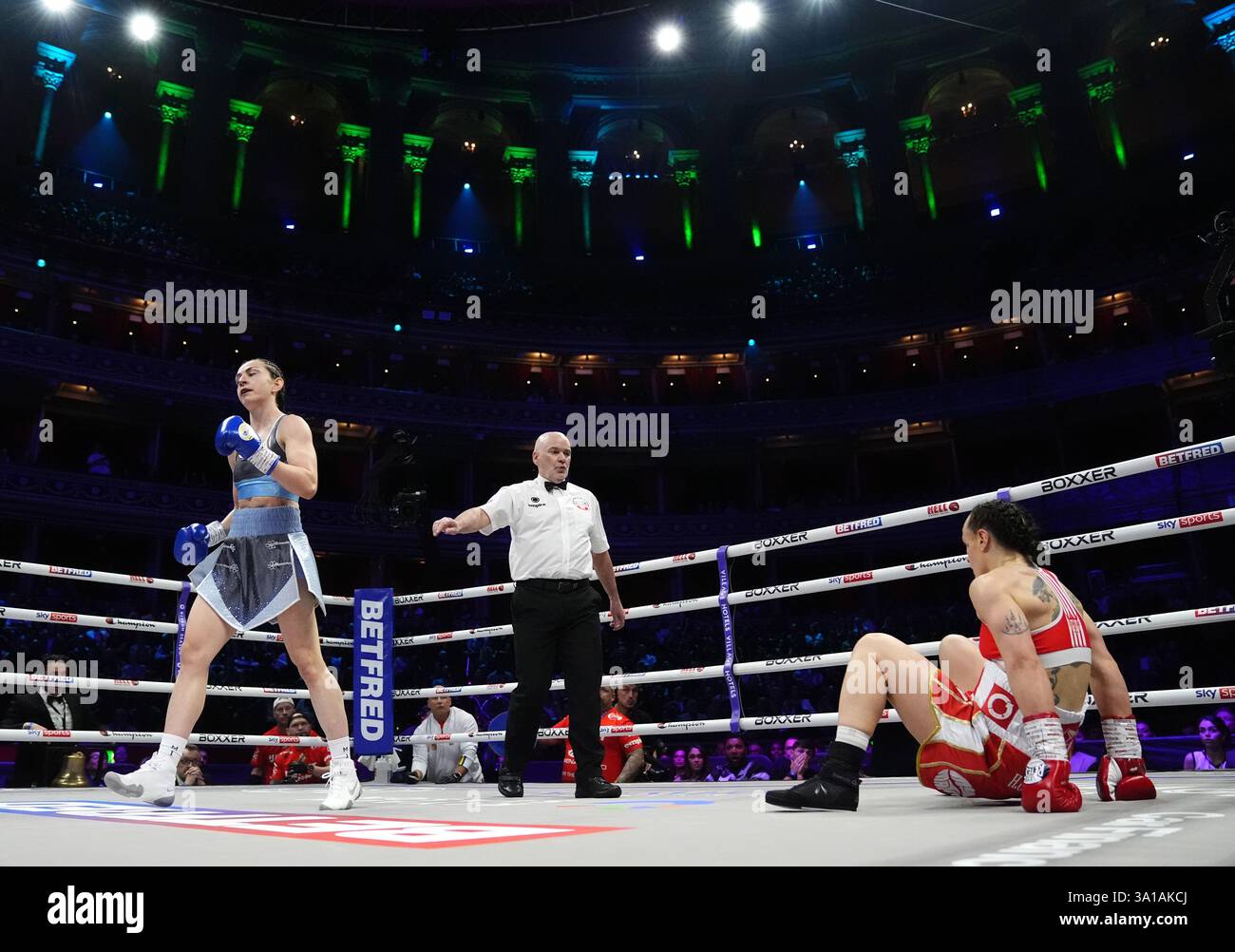 Karriss Artingstall (left) knocks down Raven Chapman in the vacant ...
