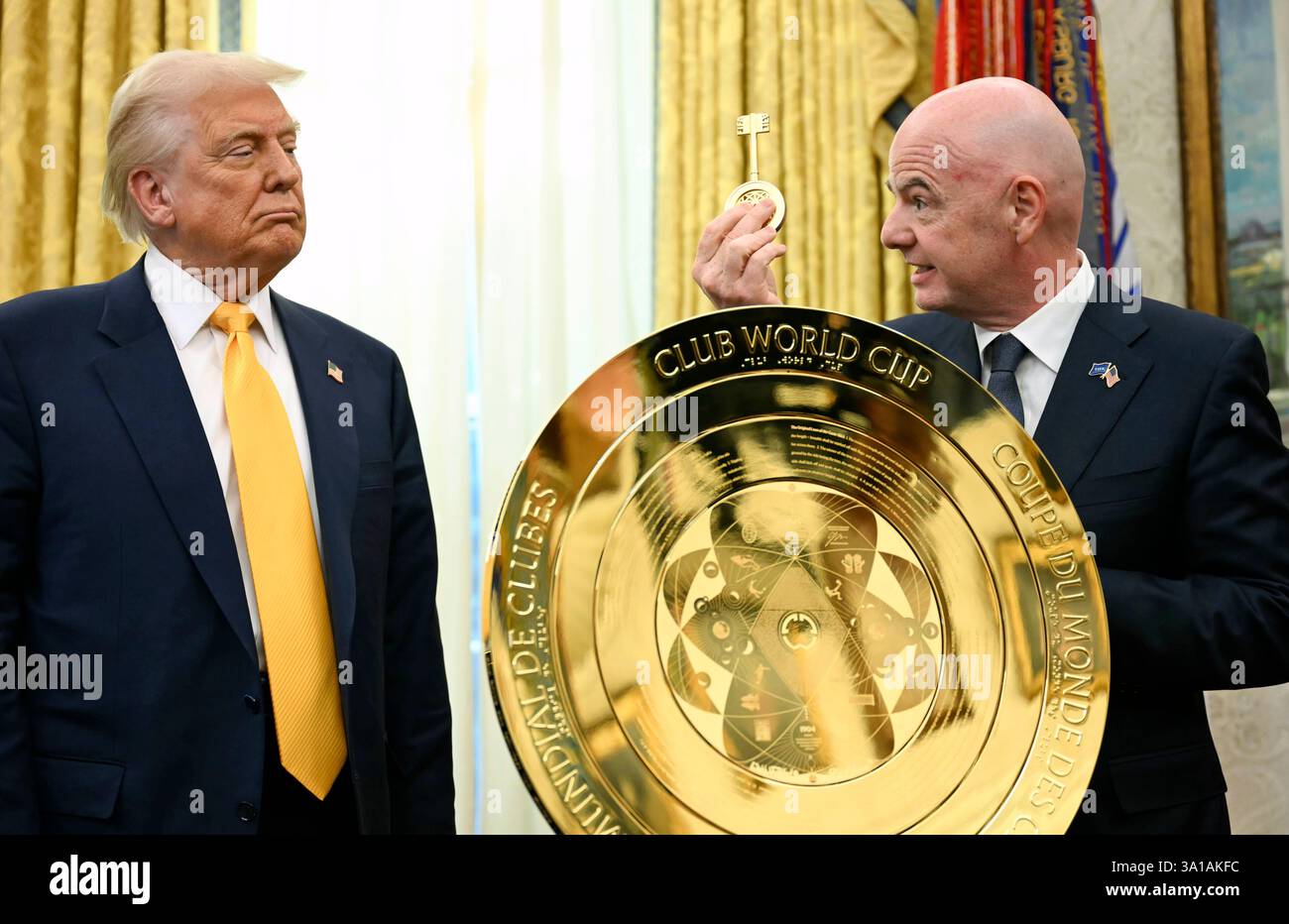 FIFA President Gianni Infantino, right, presents President Donald Trump with a key to unlock the ...