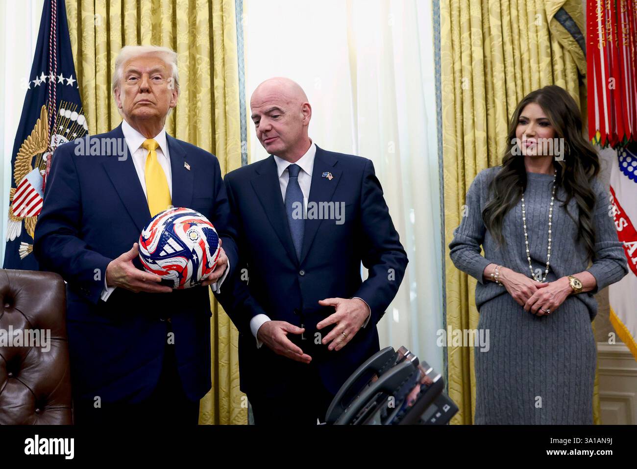 President Donald Trump, from left, holds the new FIFA Club World Cup ...