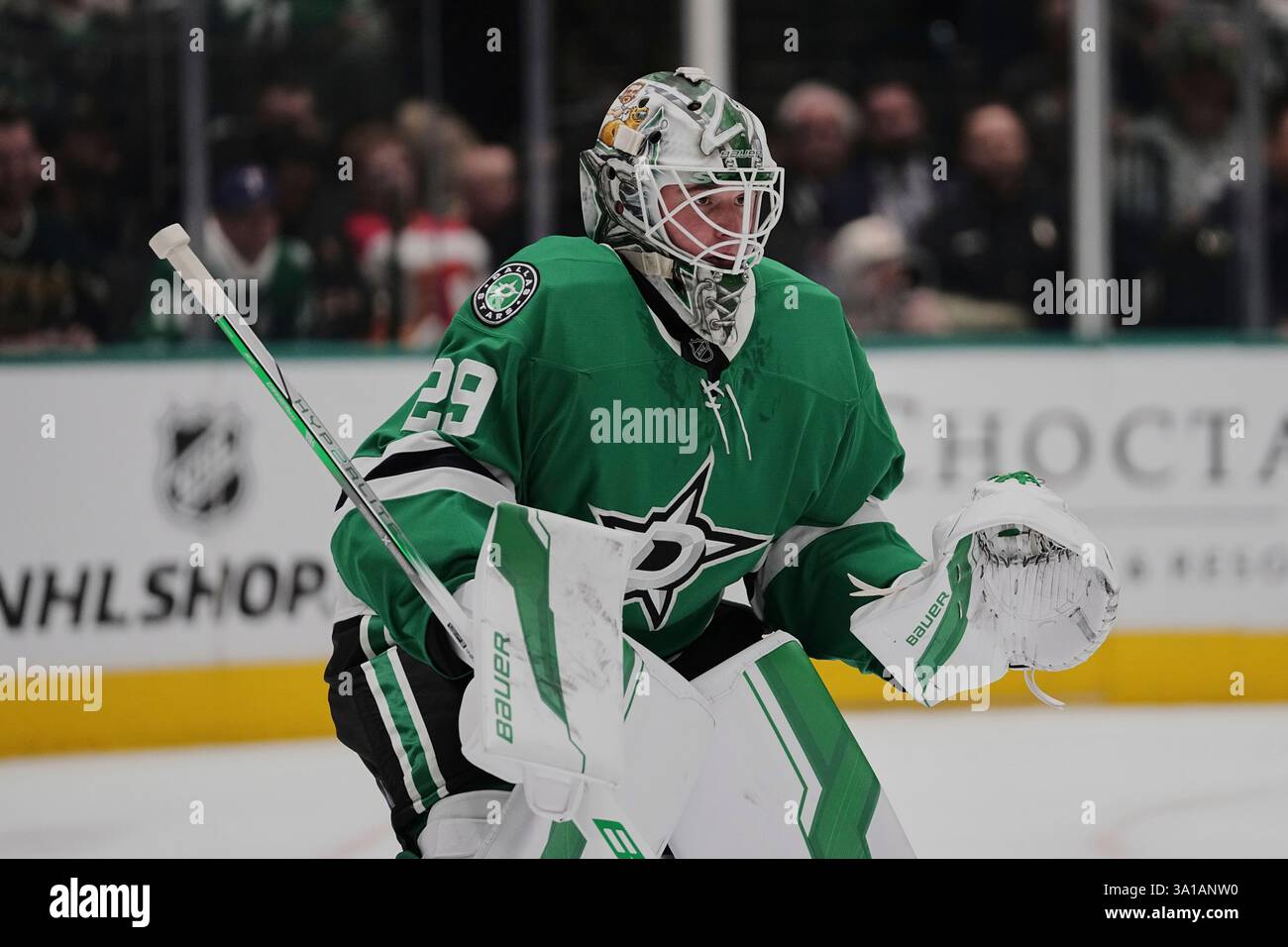 Dallas Stars goaltender Jake Oettinger minds the net during a face-off ...
