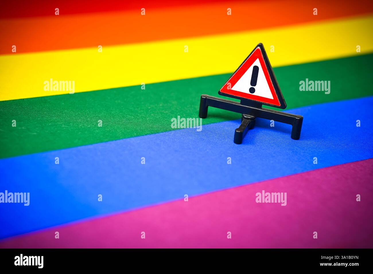 Warning sign on rainbow flag, LGBTQ, wokeness and anti-wokeness Stock ...