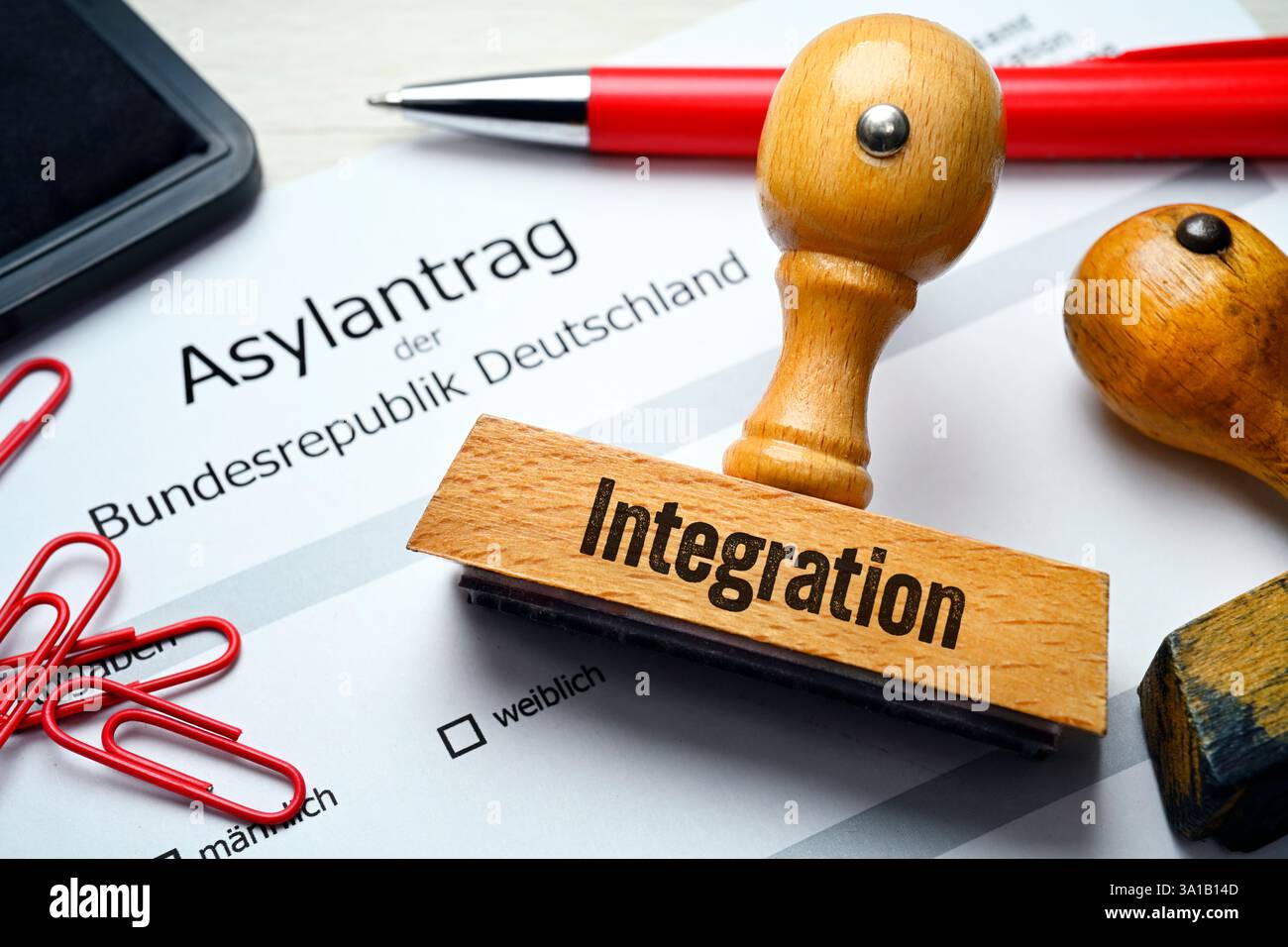 Photomontage, asylum application with stamp and inscription Integration ...