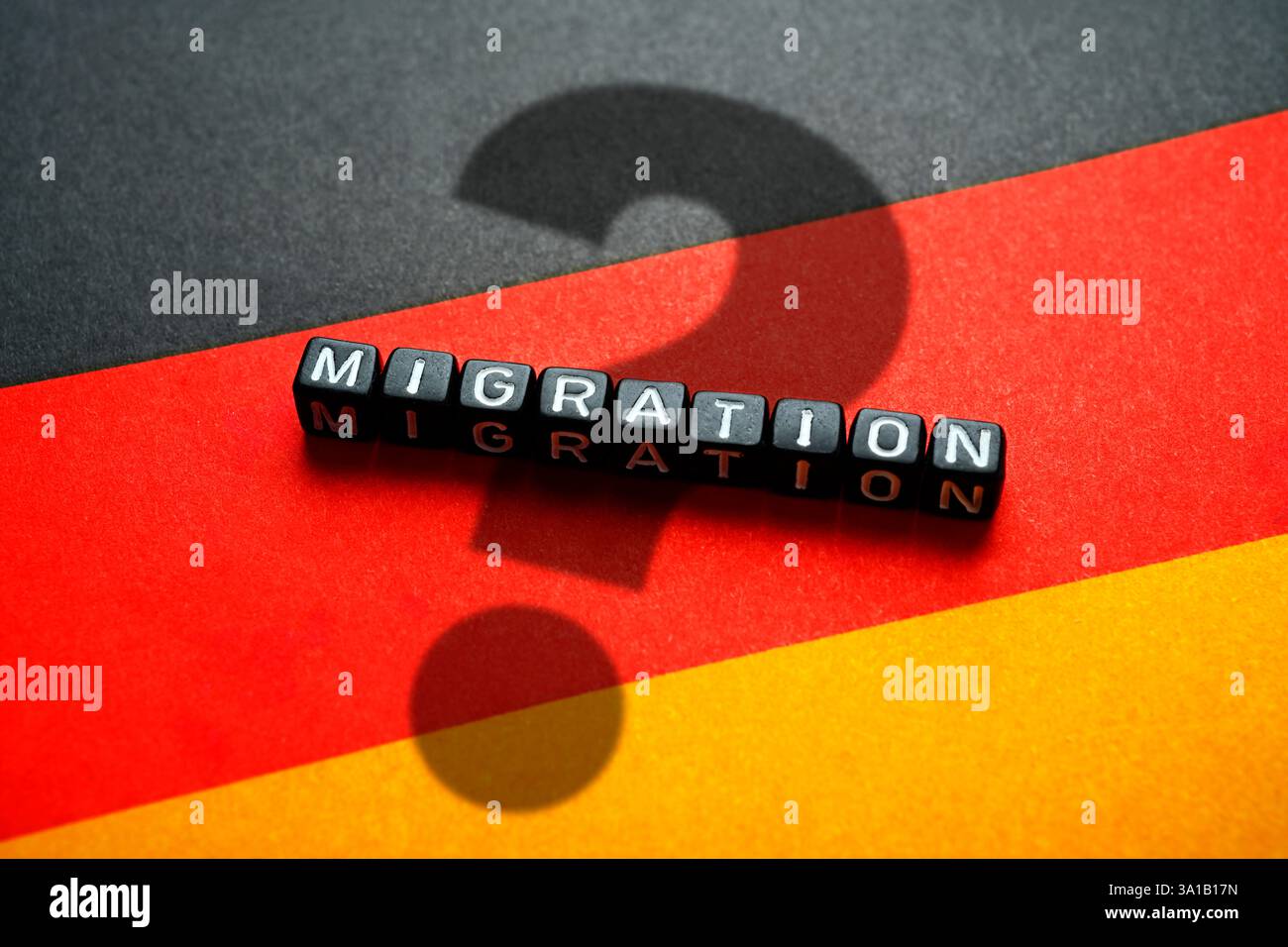 Migration lettering and question mark on German flag, [M] Stock Photo ...