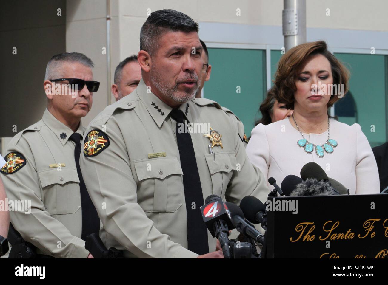 Santa Fe County Sheriff Adan Mendoza, center, answers questions about ...
